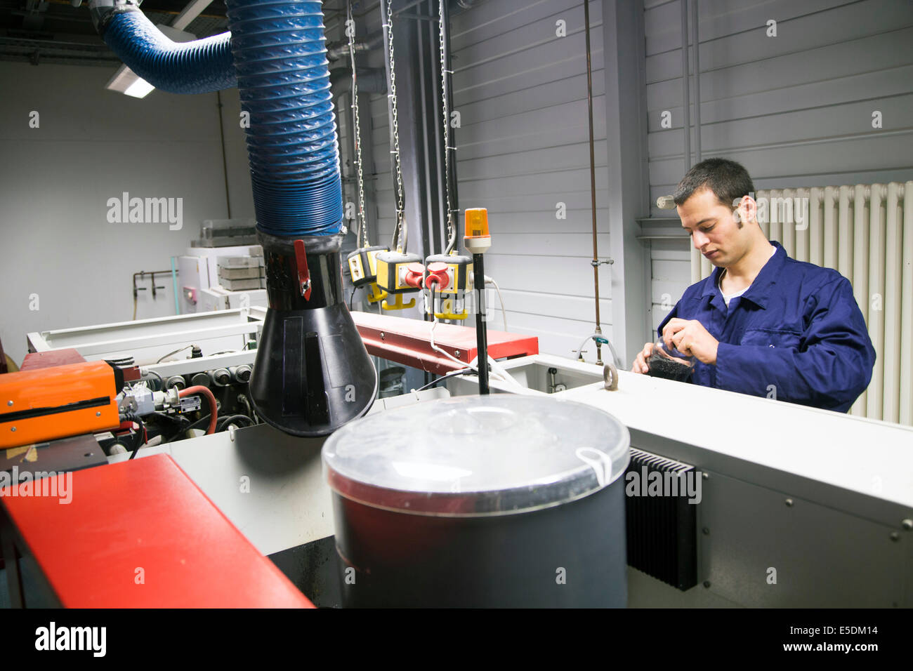 Technician working in a technical room Stock Photo - Alamy