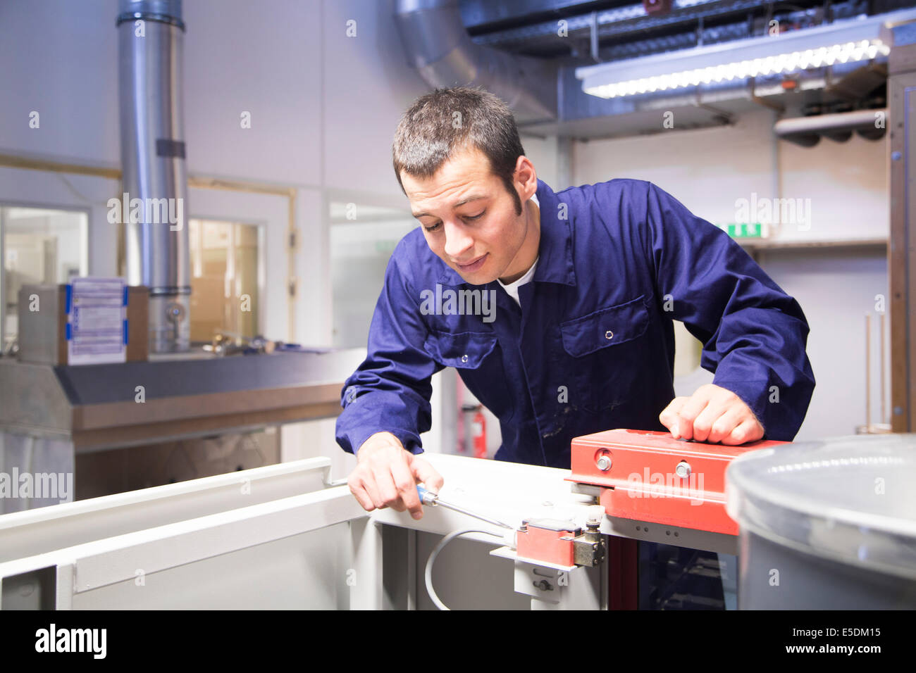 Technician working in a technical room Stock Photo - Alamy