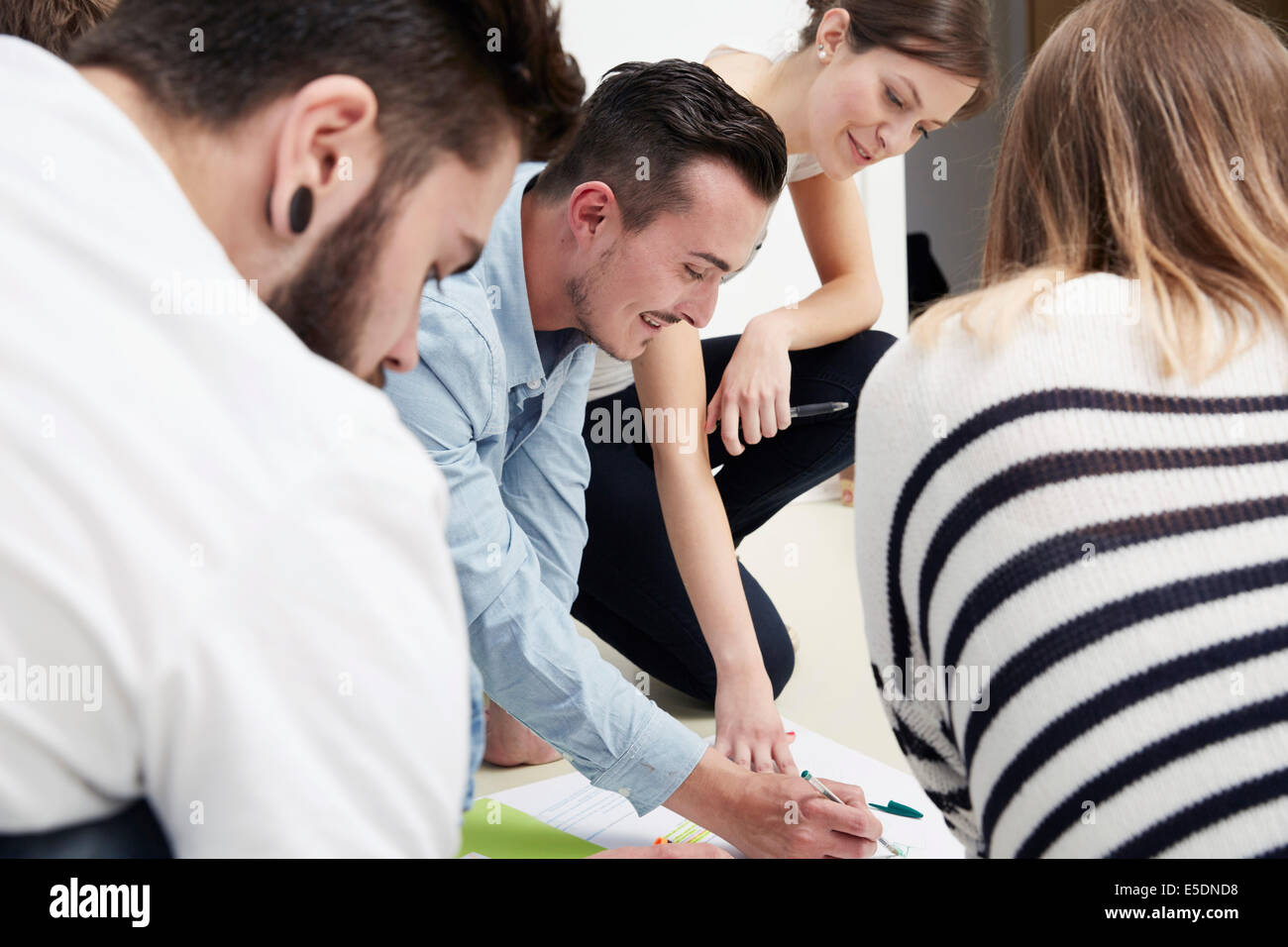 Group of creative professionals at work Stock Photo - Alamy