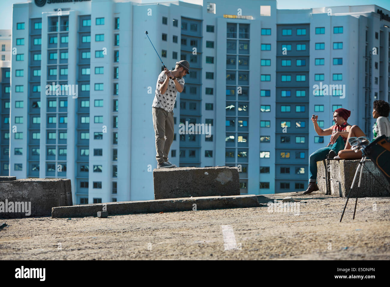 Friends playing urban golf in the city Stock Photo - Alamy
