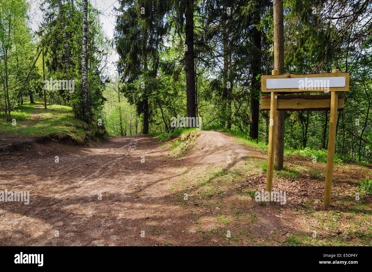 Wooden sign board on the natural trail. In the forest park Stock Photo ...