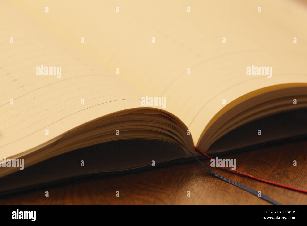 Notebook on table Stock Photo - Alamy