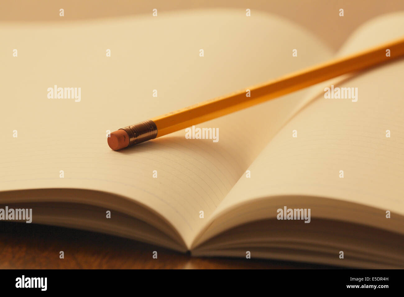 Notebook and pencil Stock Photo - Alamy