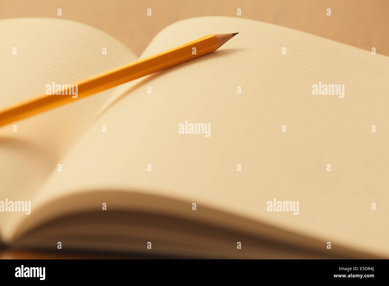 Notebook and pencil Stock Photo - Alamy