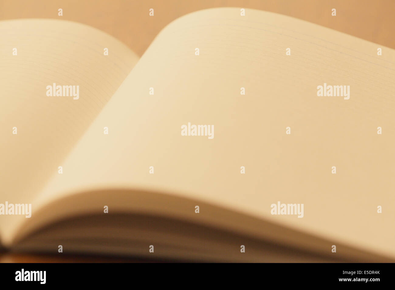 Notebook on table Stock Photo - Alamy