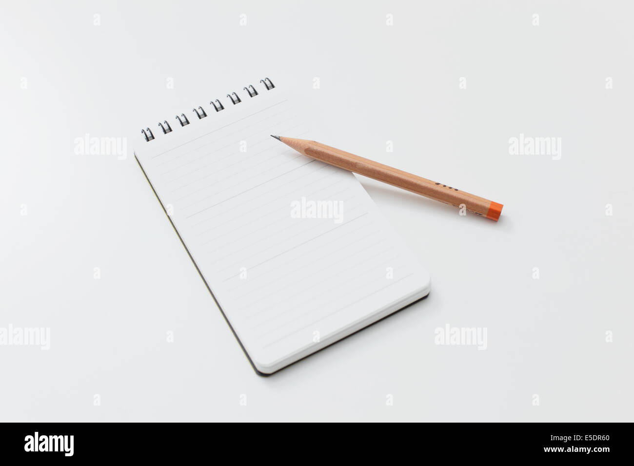 Pencil and note pad Stock Photo - Alamy