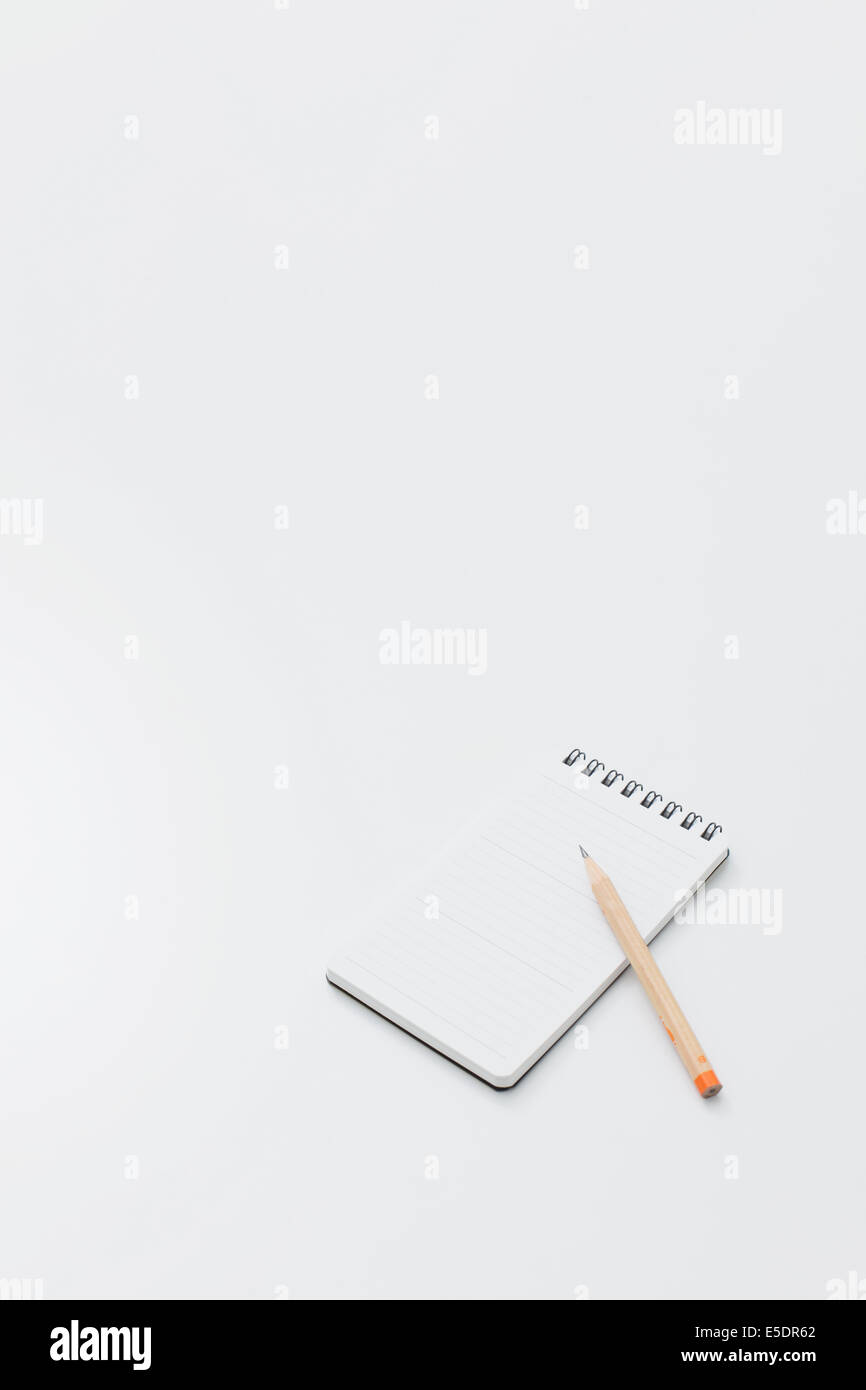 Pencil and note pad Stock Photo - Alamy