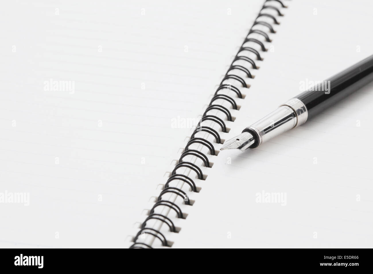 Fountain pen and notebook Stock Photo - Alamy