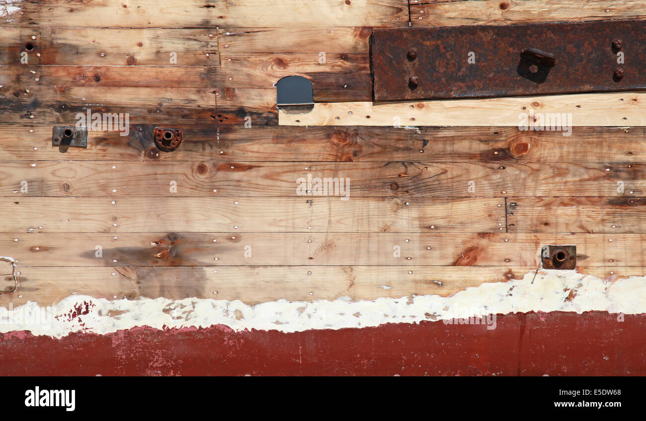 Old wooden ship fragment, hull under renovation, background photo ...