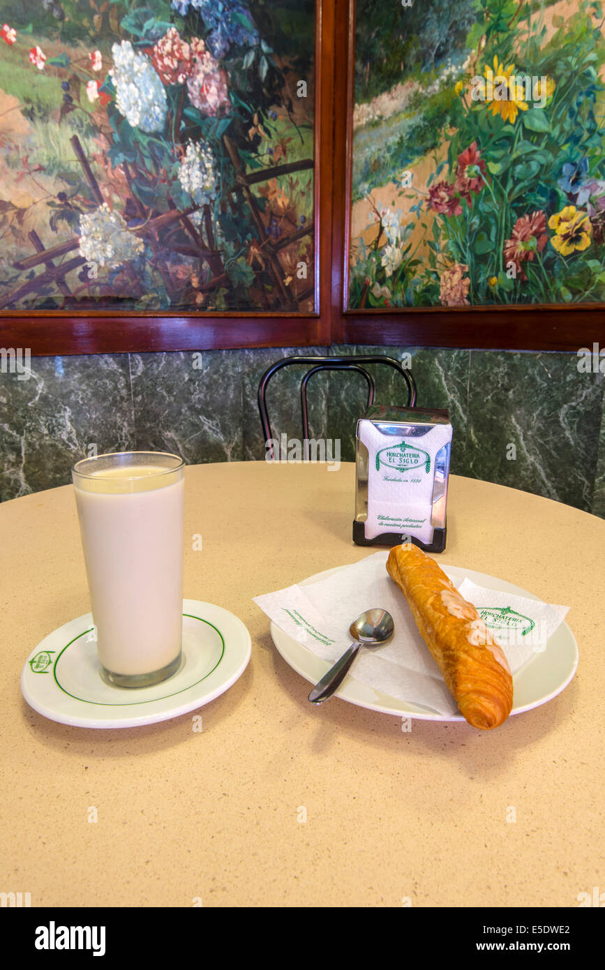 Glass of horchata served with farton sweet at Horchateria El Siglo ...