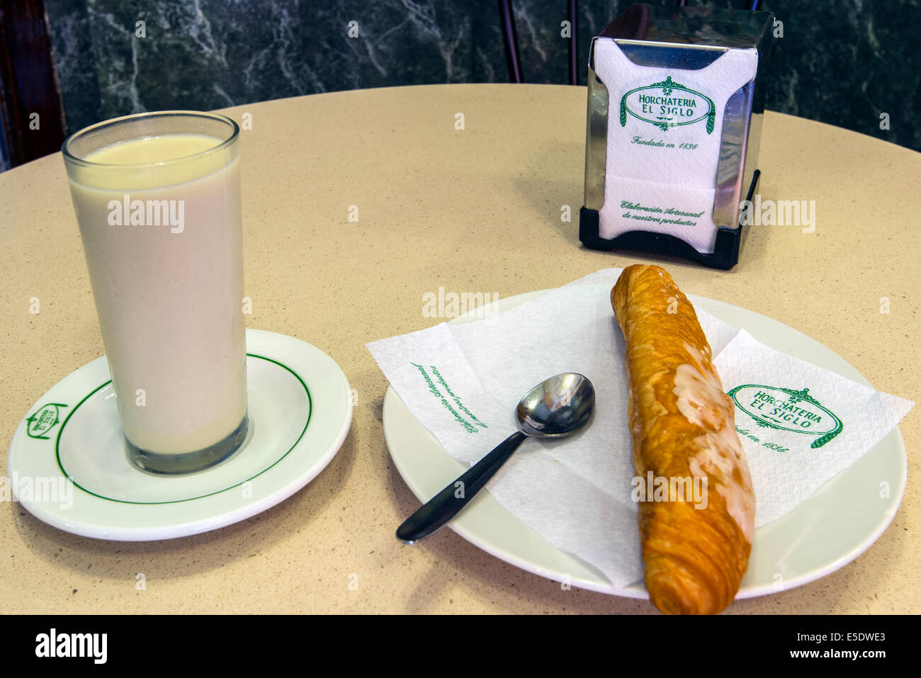 Glass of horchata served with farton sweet at Horchateria El Siglo ...
