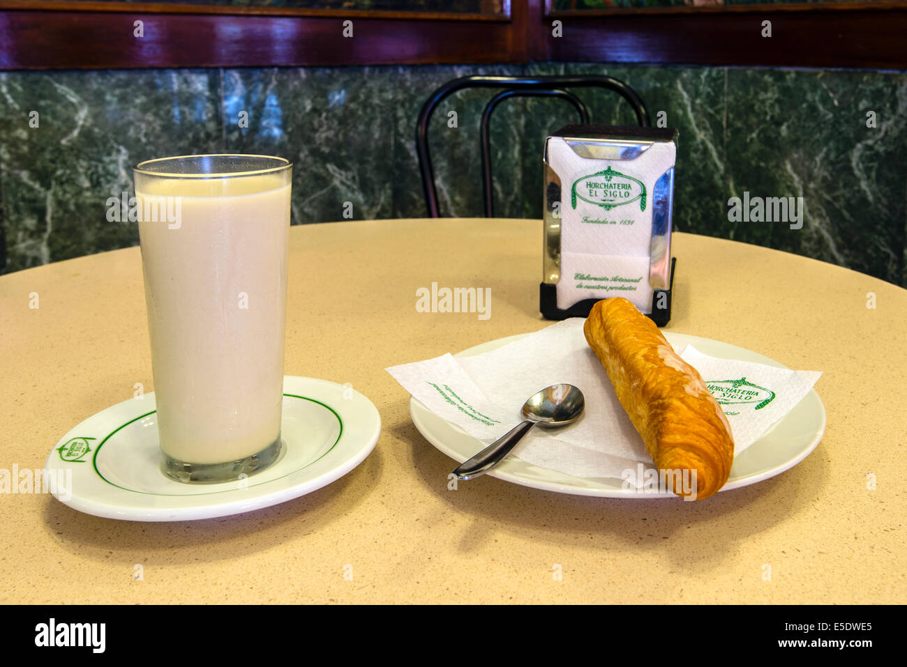 Glass of horchata served with farton sweet at Horchateria El Siglo ...