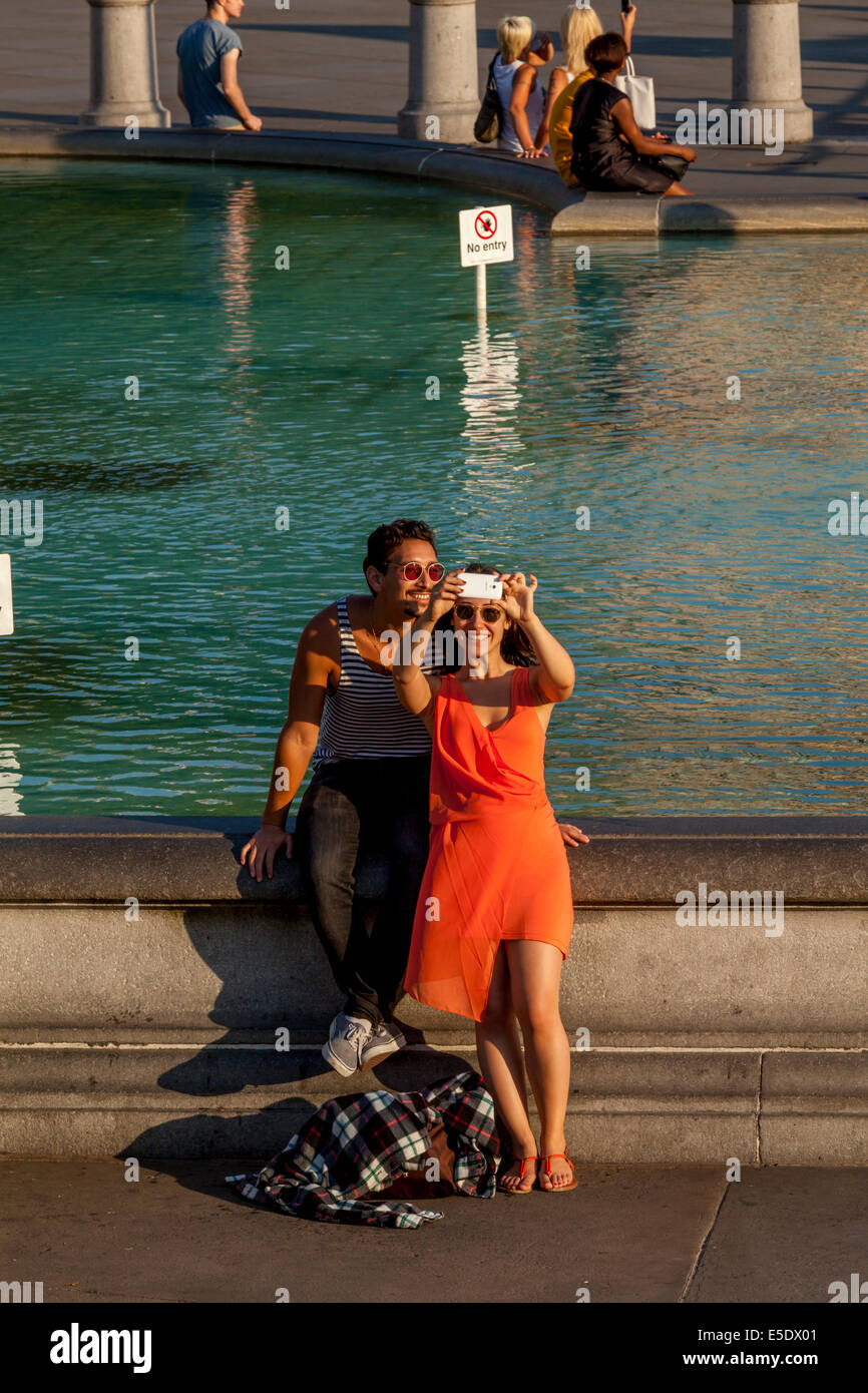 A Romantic Young Couple In Trafalgar Square, London, England Stock ...