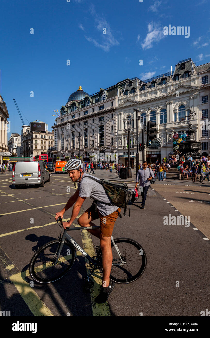 A Cyclist In Piccadilly Circus, London, England Stock Photo - Alamy