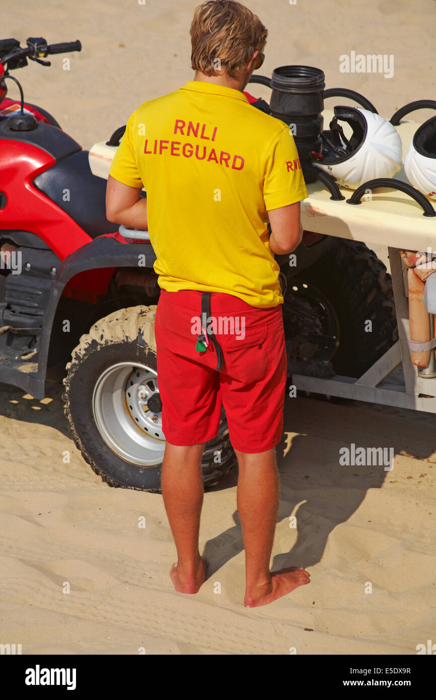RNLI Lifeguard at Bournemouth beach in July Stock Photo - Alamy