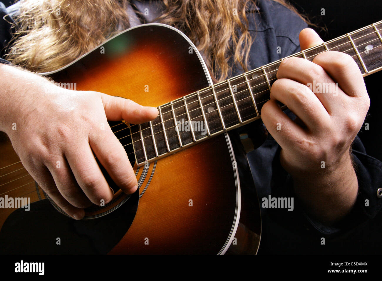 Man playing acoustic guitar close-up Stock Photo - Alamy