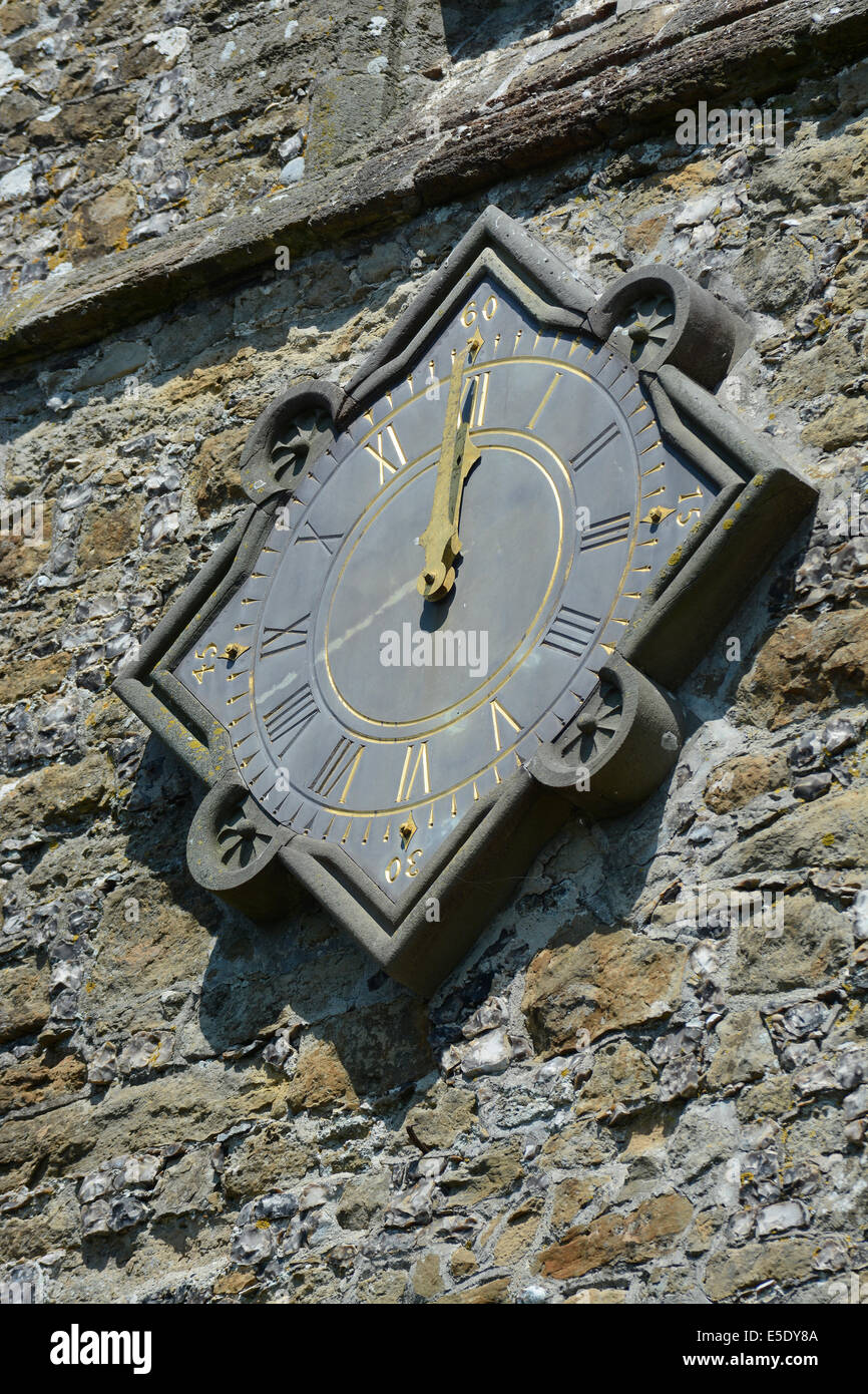 Unusual square church clock showing midday or twelve o'clock. Saint ...