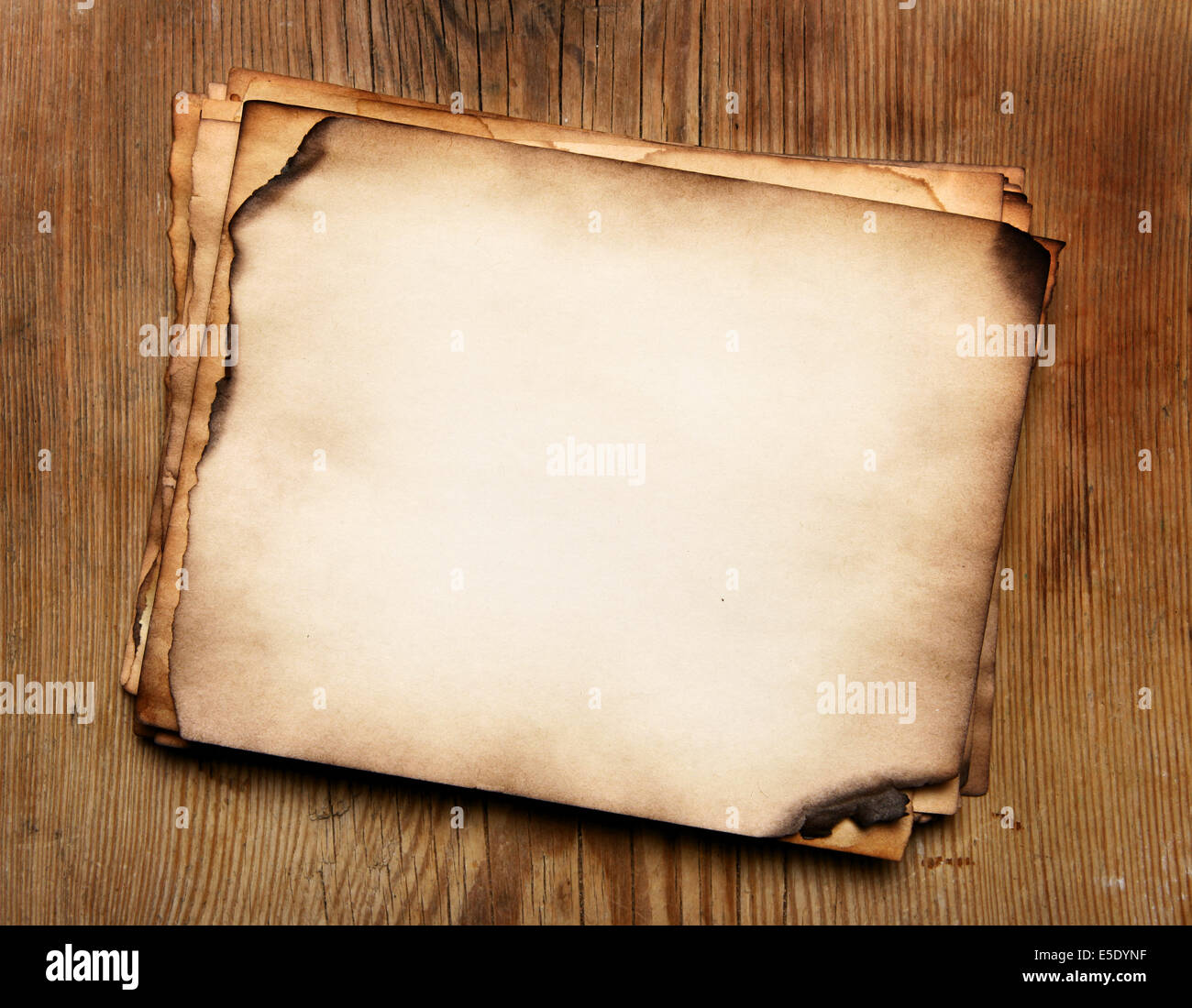 Stacks old papers on a wood table Stock Photo - Alamy