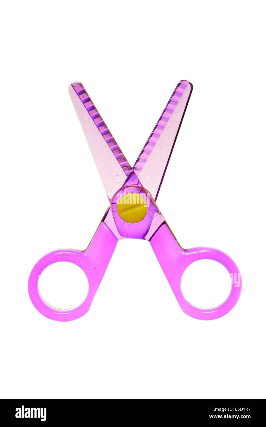 Toy scissors isolated over white background Stock Photo - Alamy