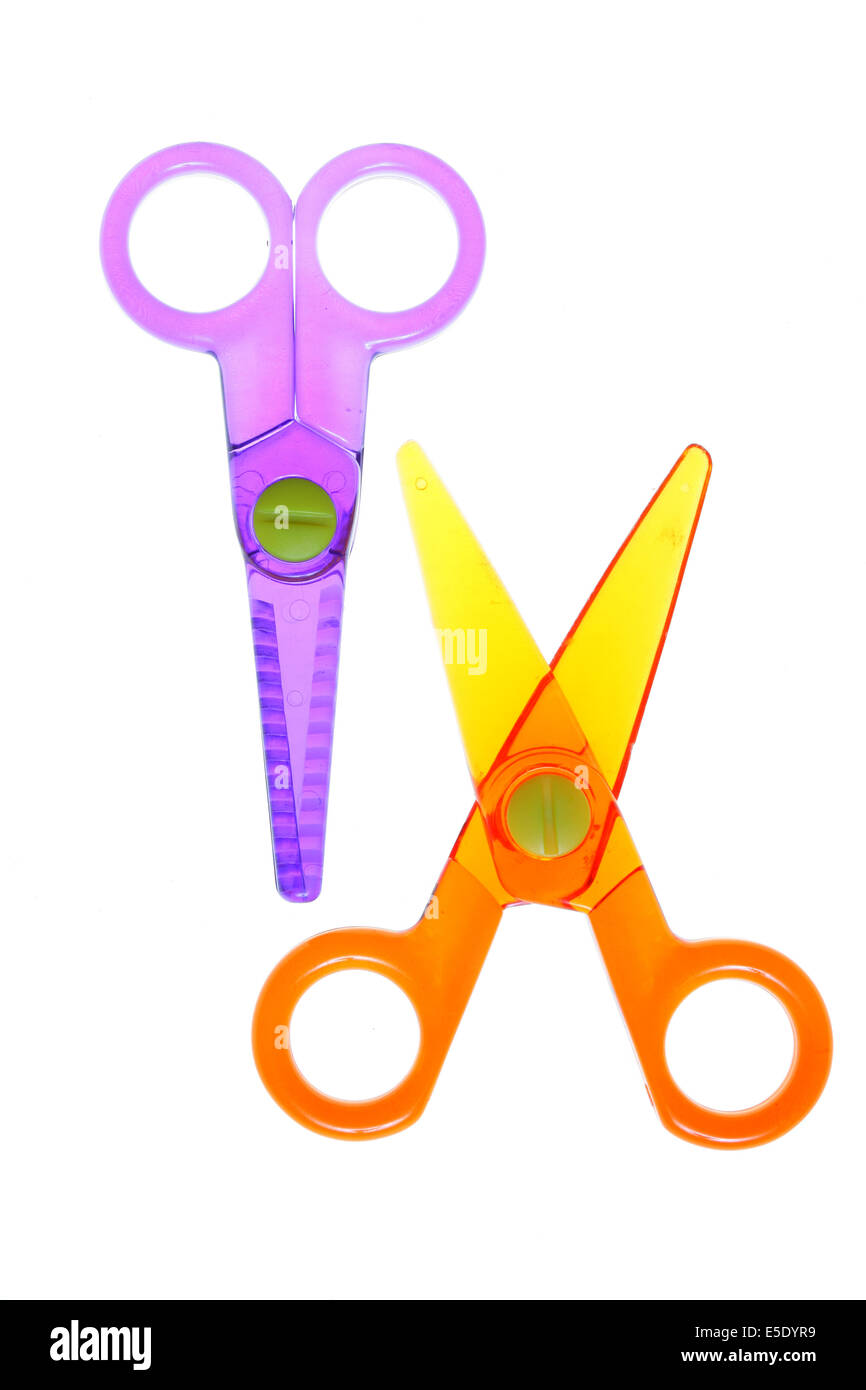 Toy scissors isolated over white background Stock Photo - Alamy