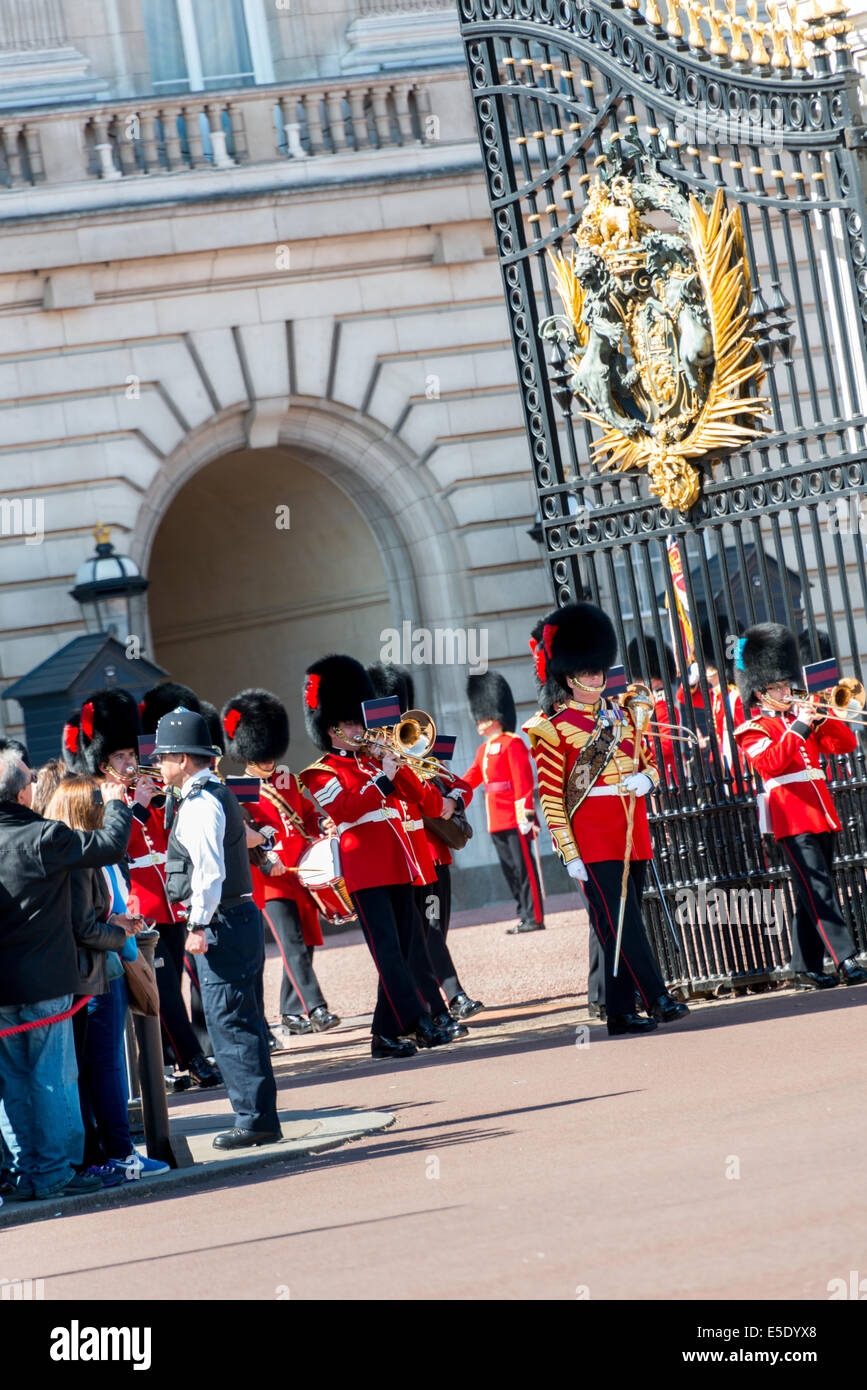 Changing of the Guard at Buckingham Palace is a ceremony of the new guard changing place with ...