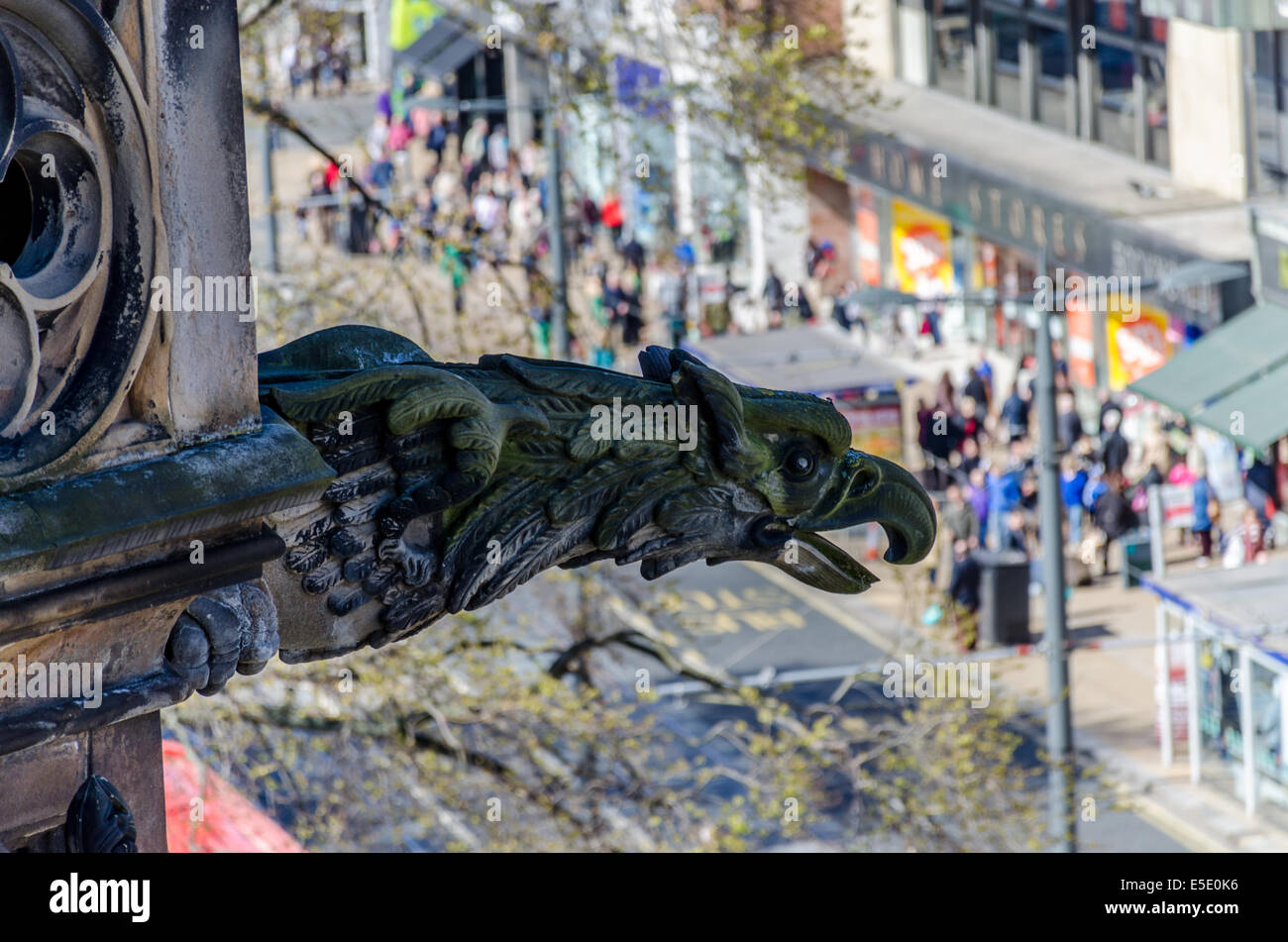 A gargoyle like bird on The Scott Monument in Edinburgh looks out over ...