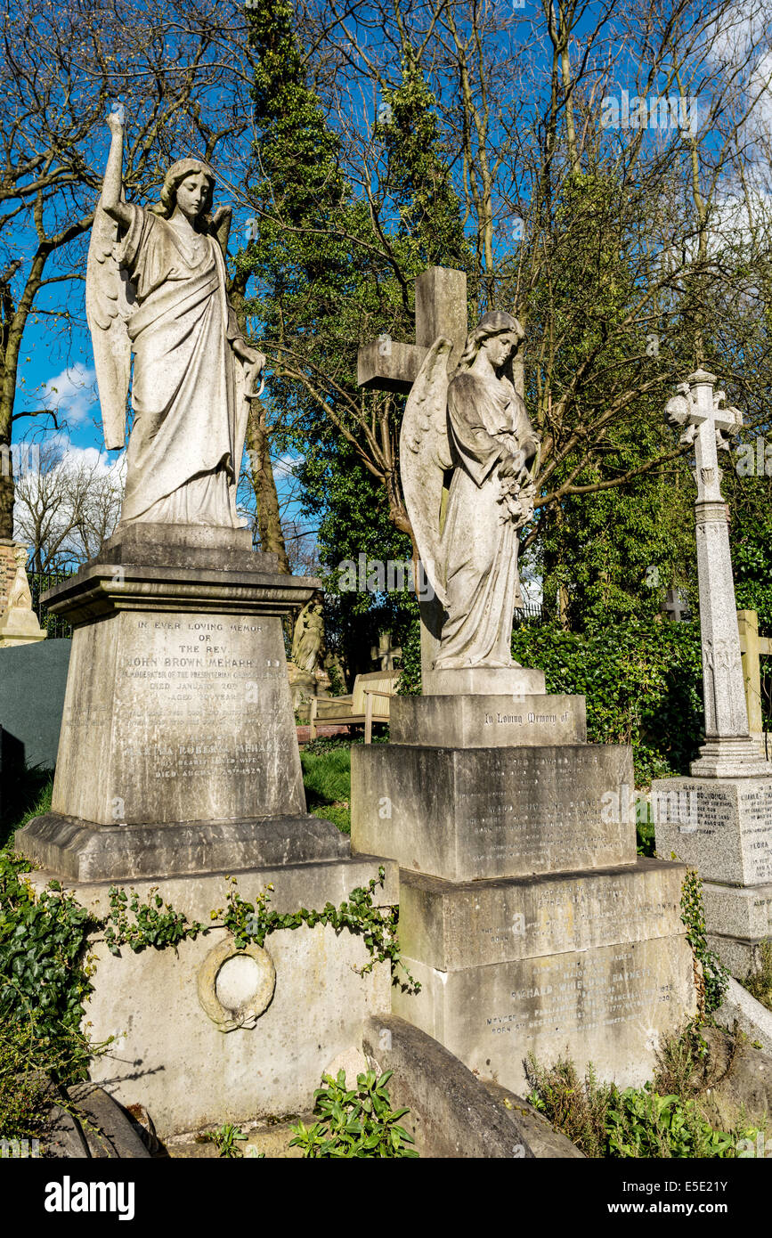 Angels at Highgate Cemetery. Highgate Cemetery is a place of burial in ...