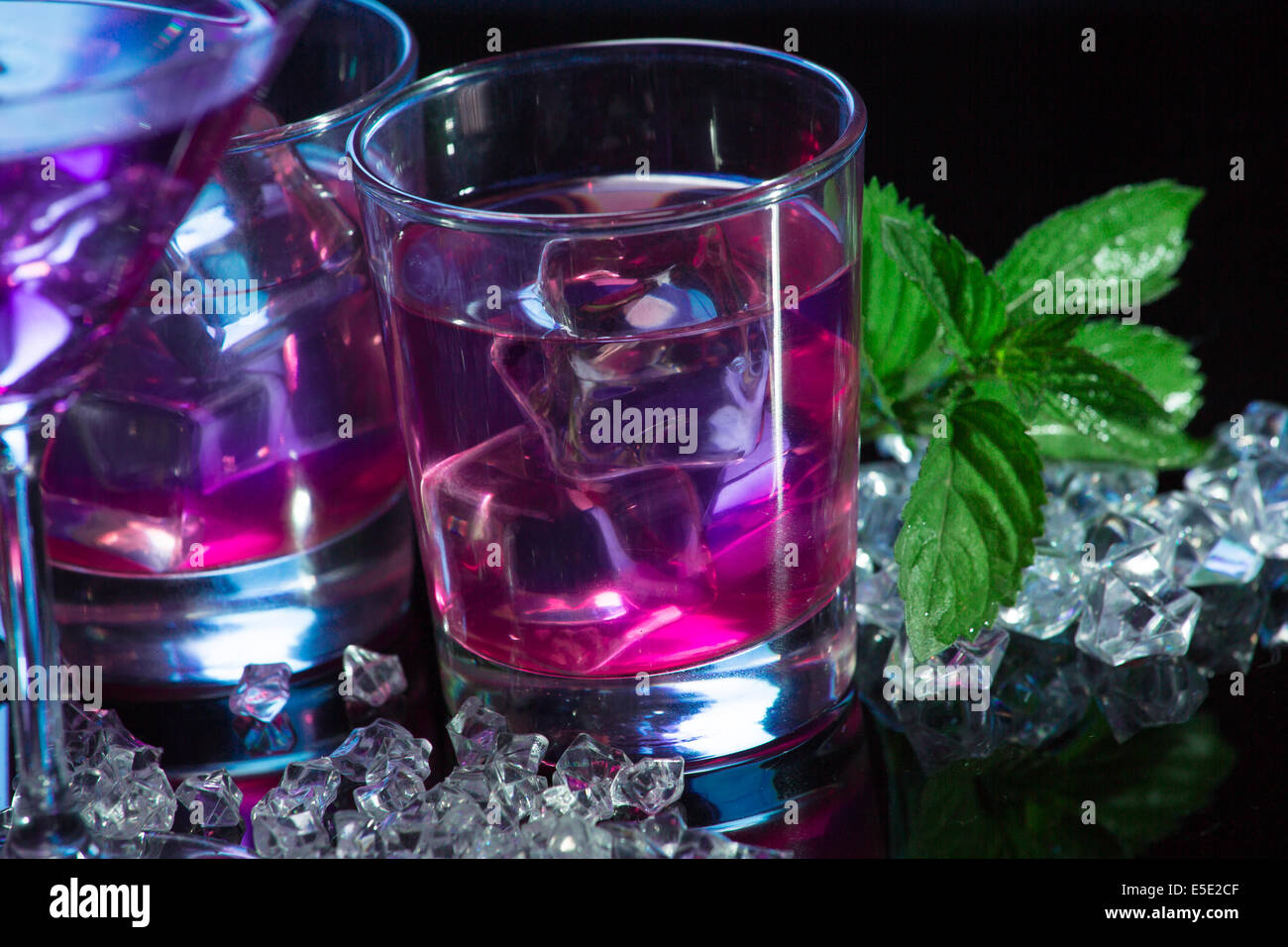 Violet coctail with ice cubes Stock Photo - Alamy