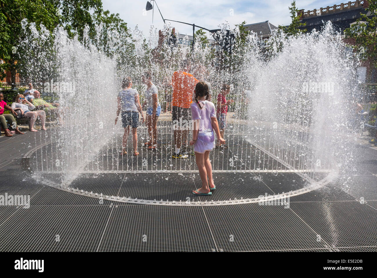 Amsterdam, Holland, Tourist Children Cooling off in Public Garden ...