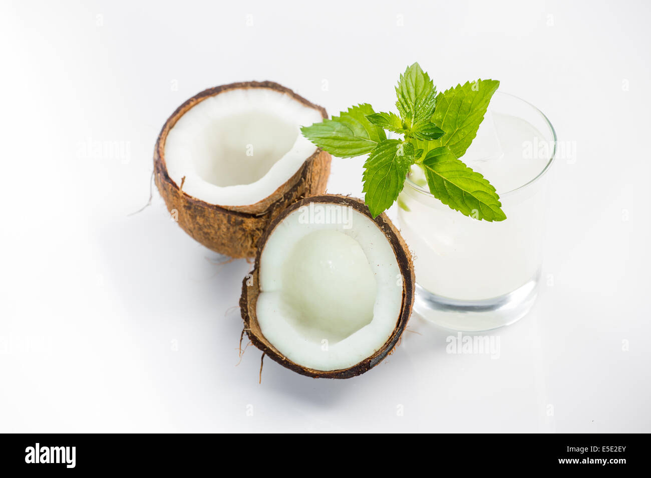 Coconut cocktail on white background with mint Stock Photo - Alamy