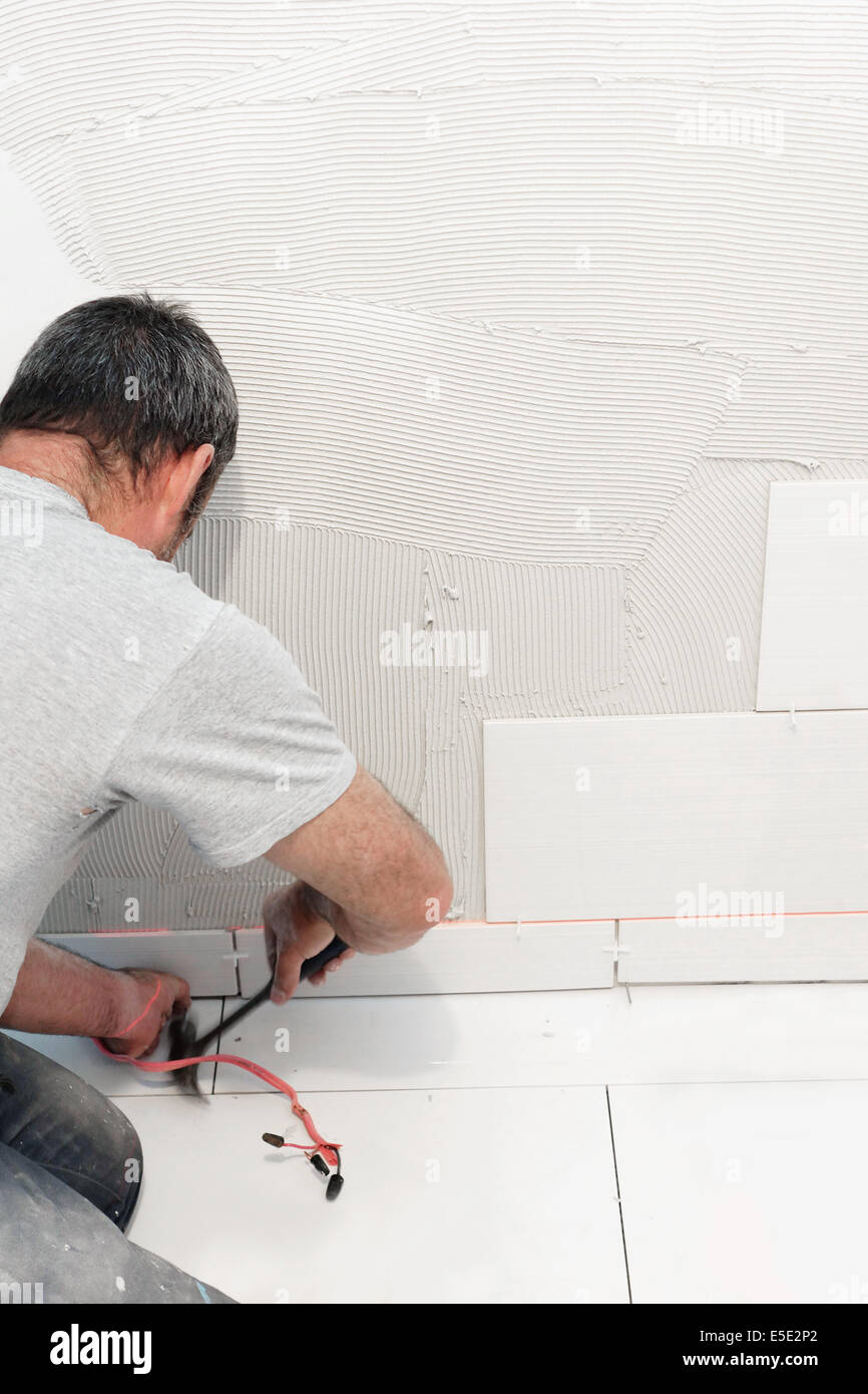 Installing ceramic floor tile hi-res stock photography and images - Alamy