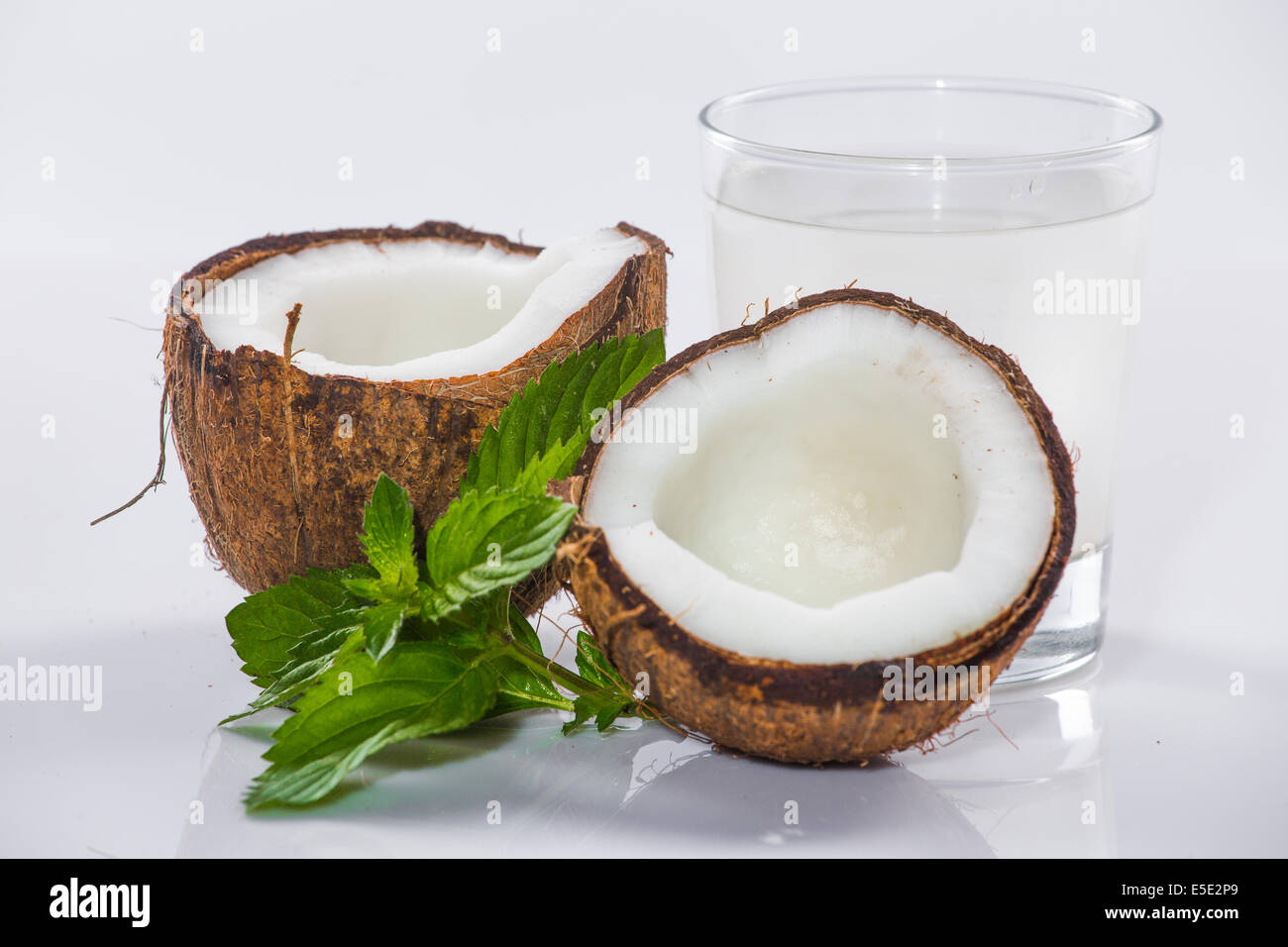 Coconut cocktail on white background with mint Stock Photo - Alamy