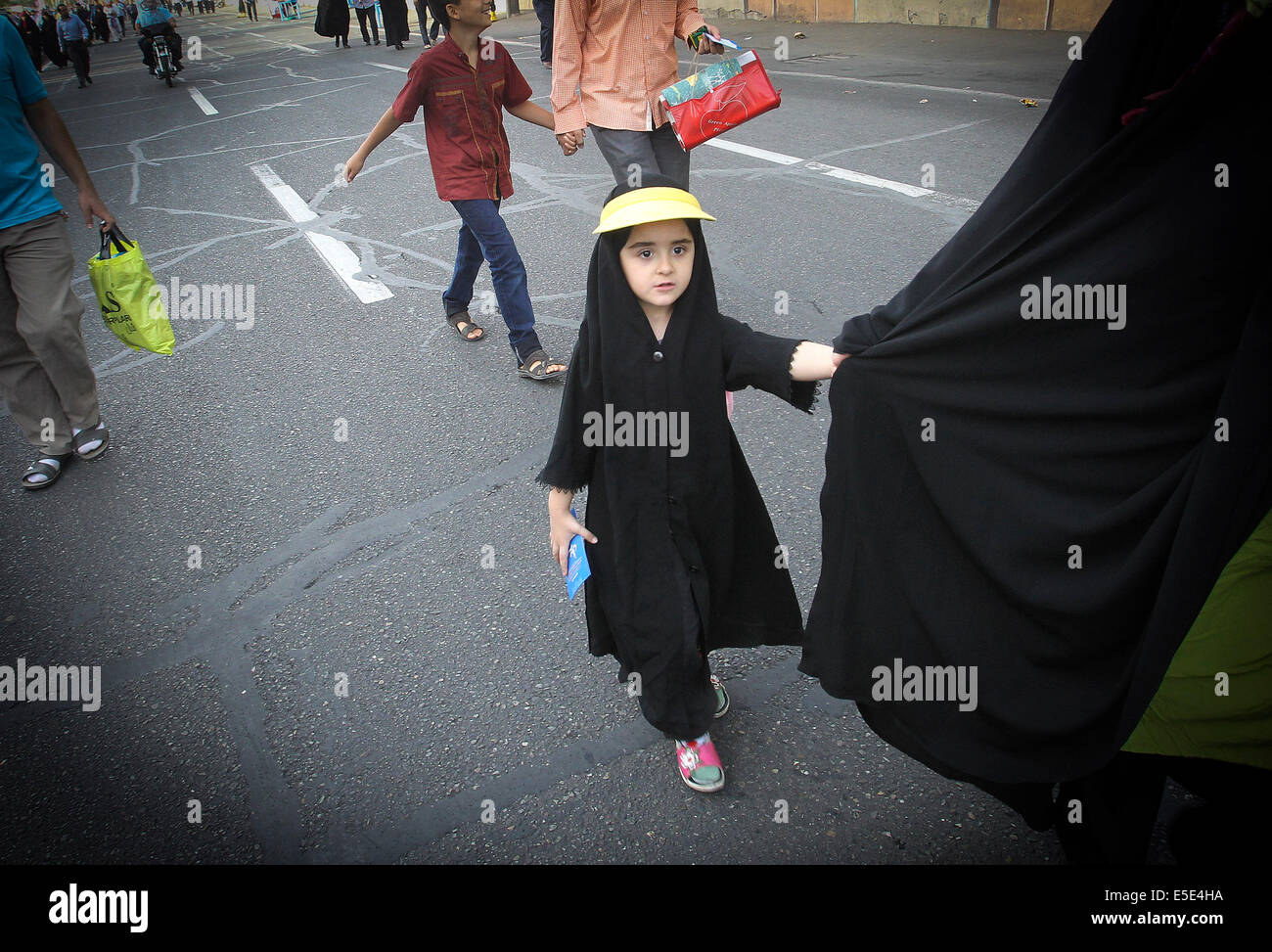 Tehran, Iran. 29th July, 2014. Iranian Muslims arrive for Eid al-Fitr ...
