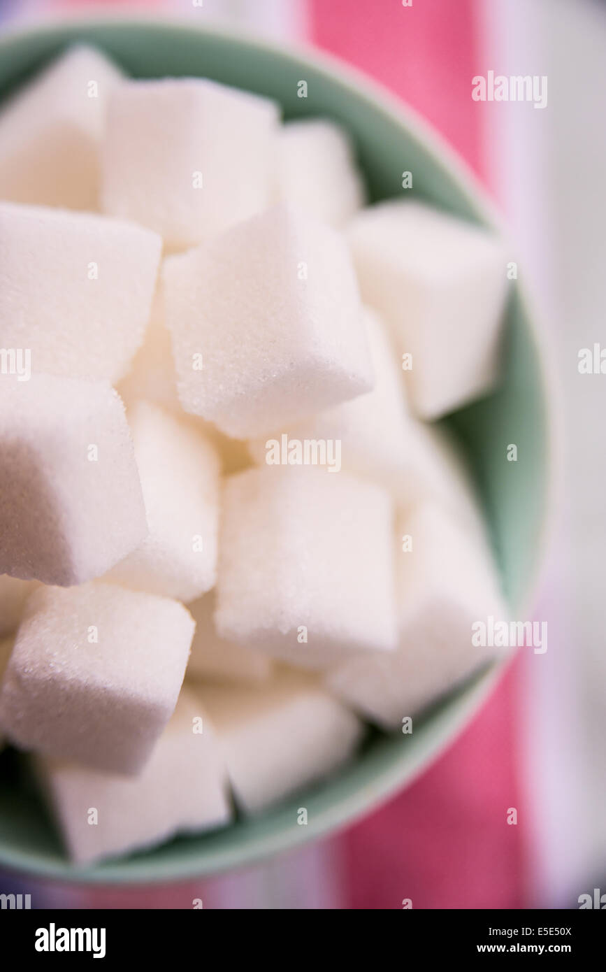 White Sugar cubes in a green bowl from above Stock Photo - Alamy