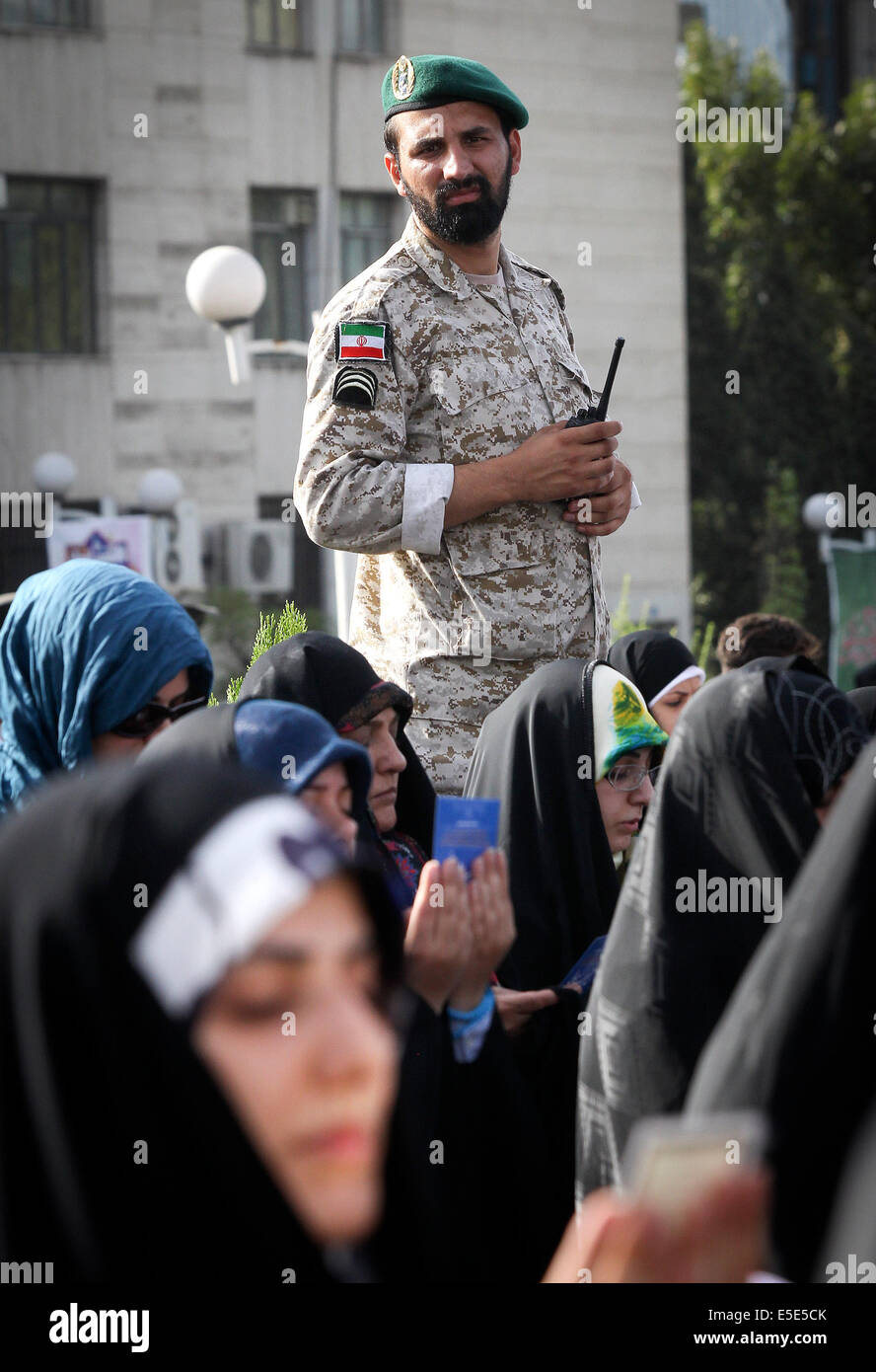 Tehran, Iran. 29th July, 2014. An Iranian security guard watches on at ...