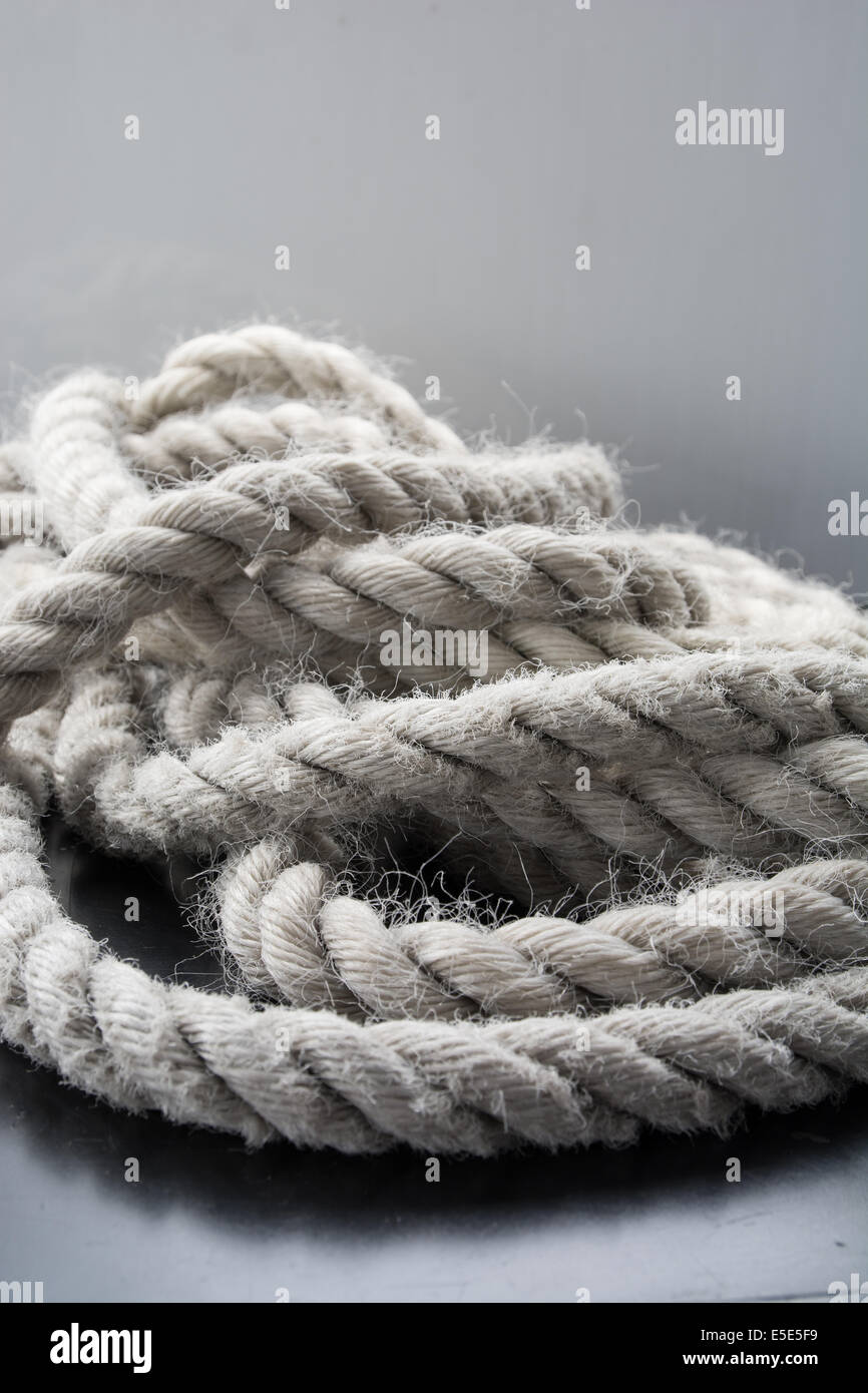 A loose coil of rope with grey background. Aboard the '6 Meteor ...