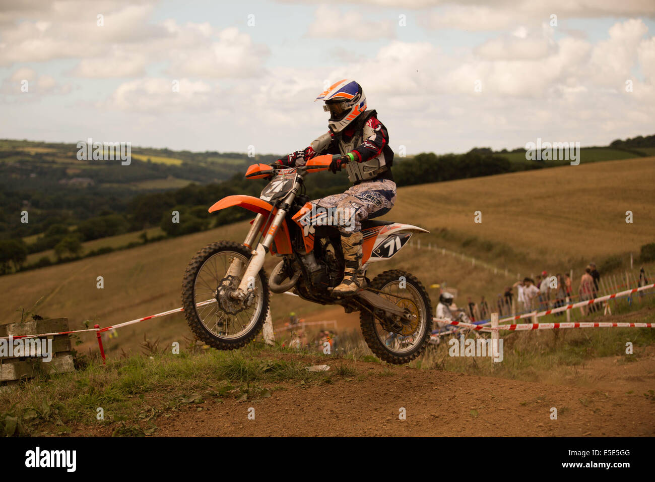 Motocross race rider on jump Stock Photo - Alamy
