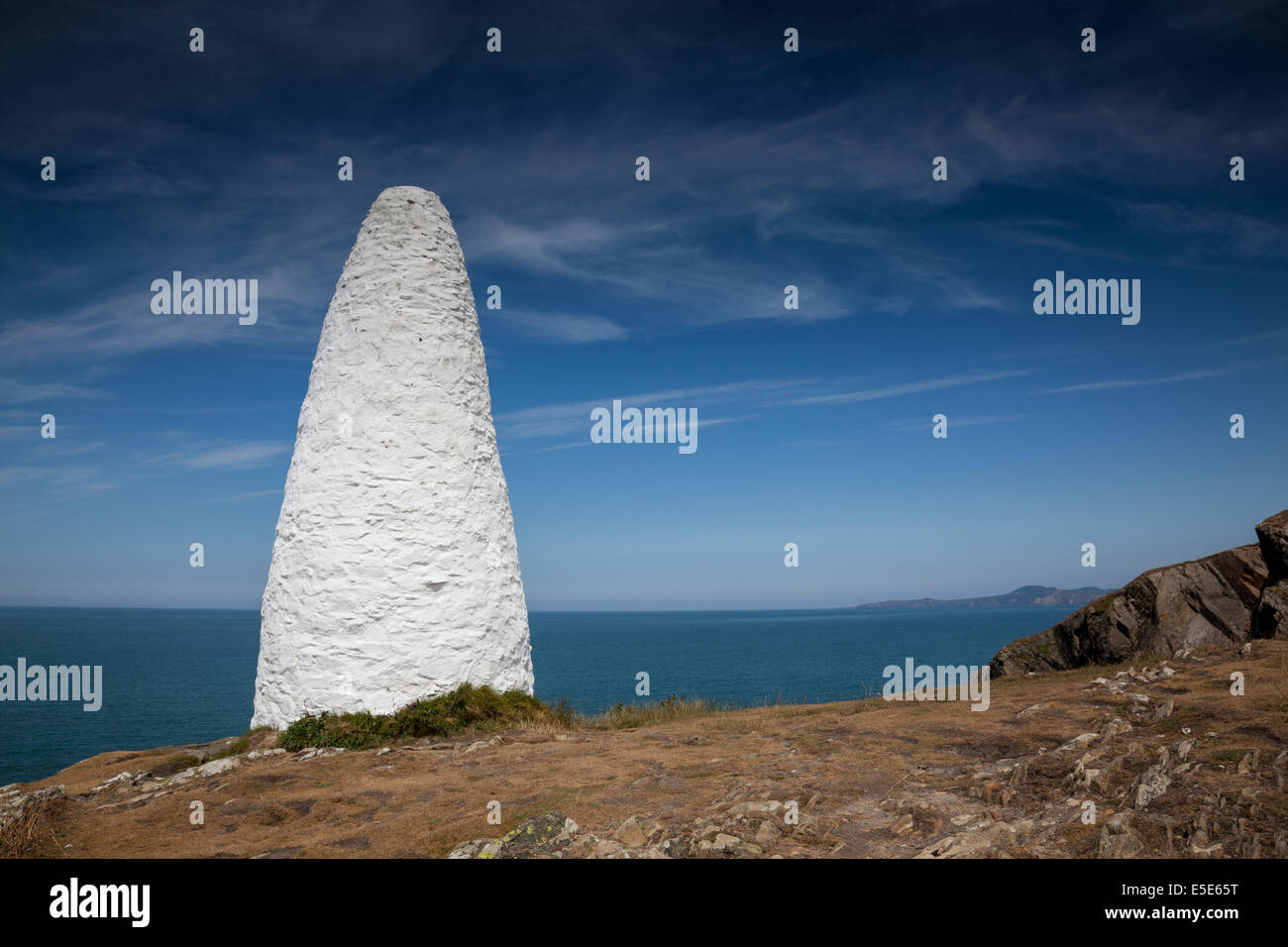 White stone beacon at the entrance to Porthgain Harbour, near Fishguard ...