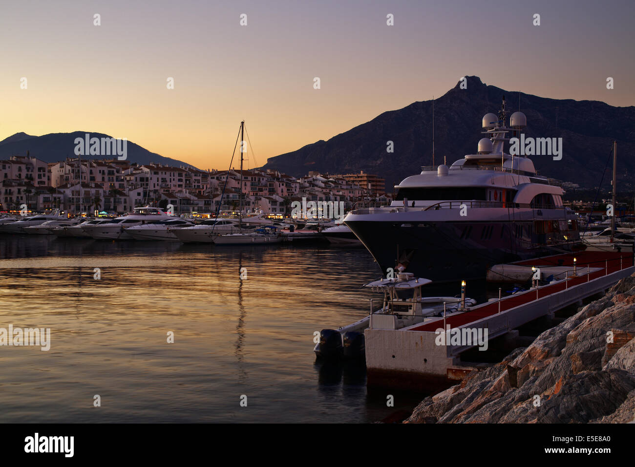 Luxury yachts and motor boats moored in Puerto Banus marina in Marbella ...