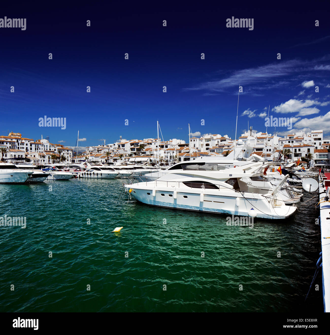 Luxury yachts and motor boats moored in Puerto Banus marina in Marbella ...