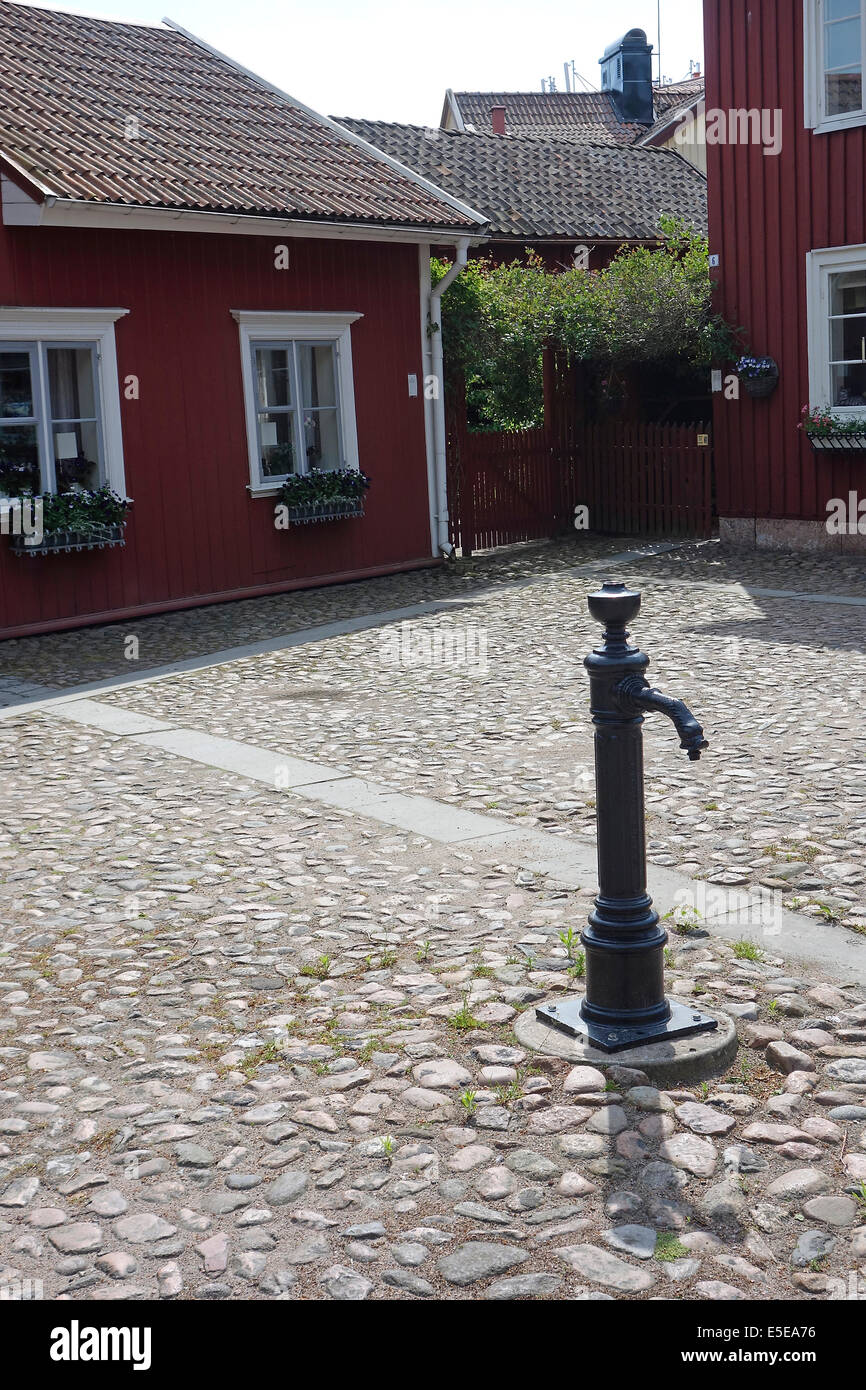 Public water tap in the middle of cobbled square of Old Lidköping ...