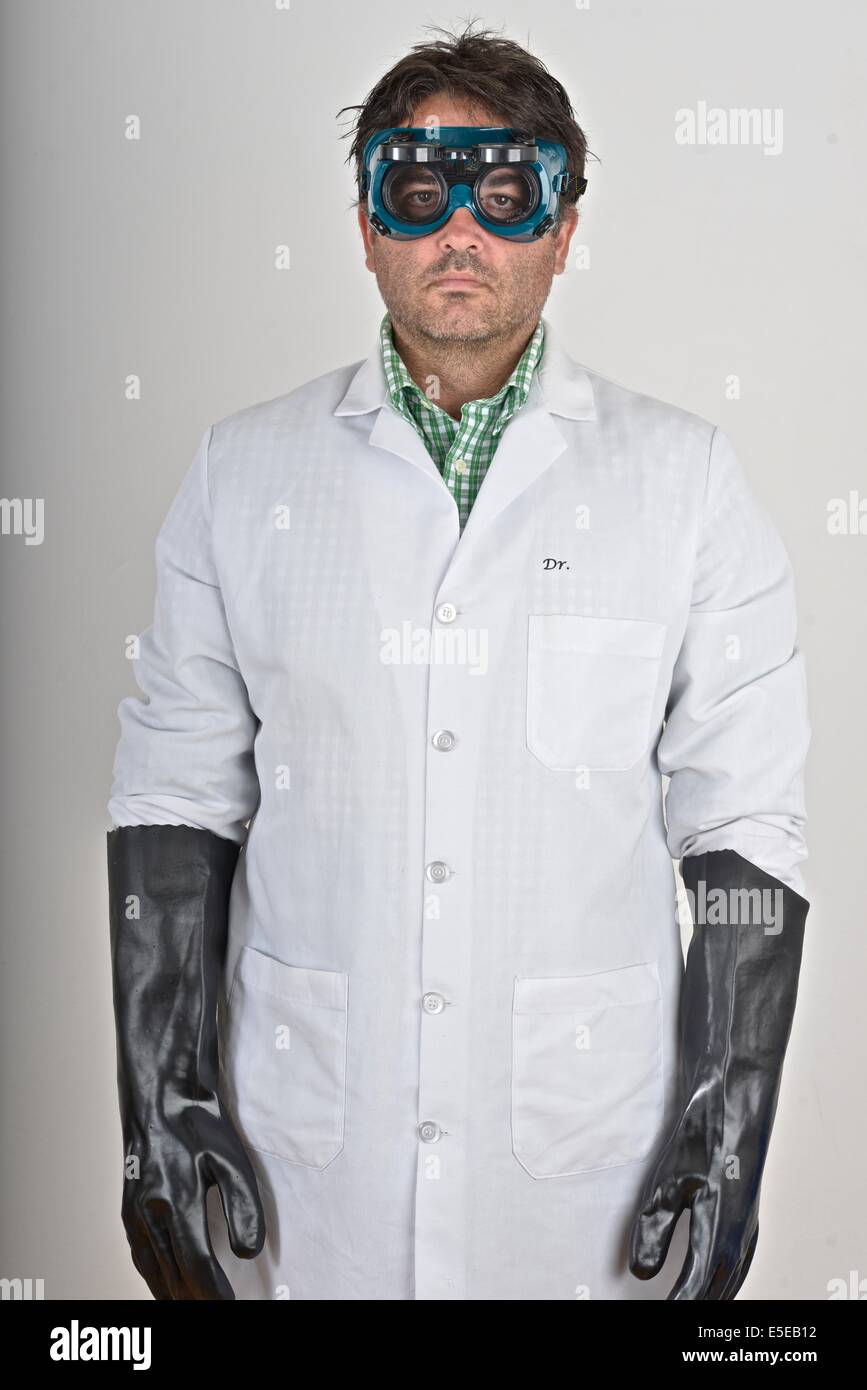 Crazy scientist wearing a eye protection and gloves Stock Photo - Alamy