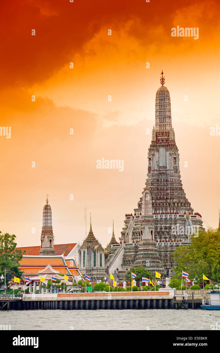wat arun, temple of the dawn under golden clouds, bangkok, thailand ...