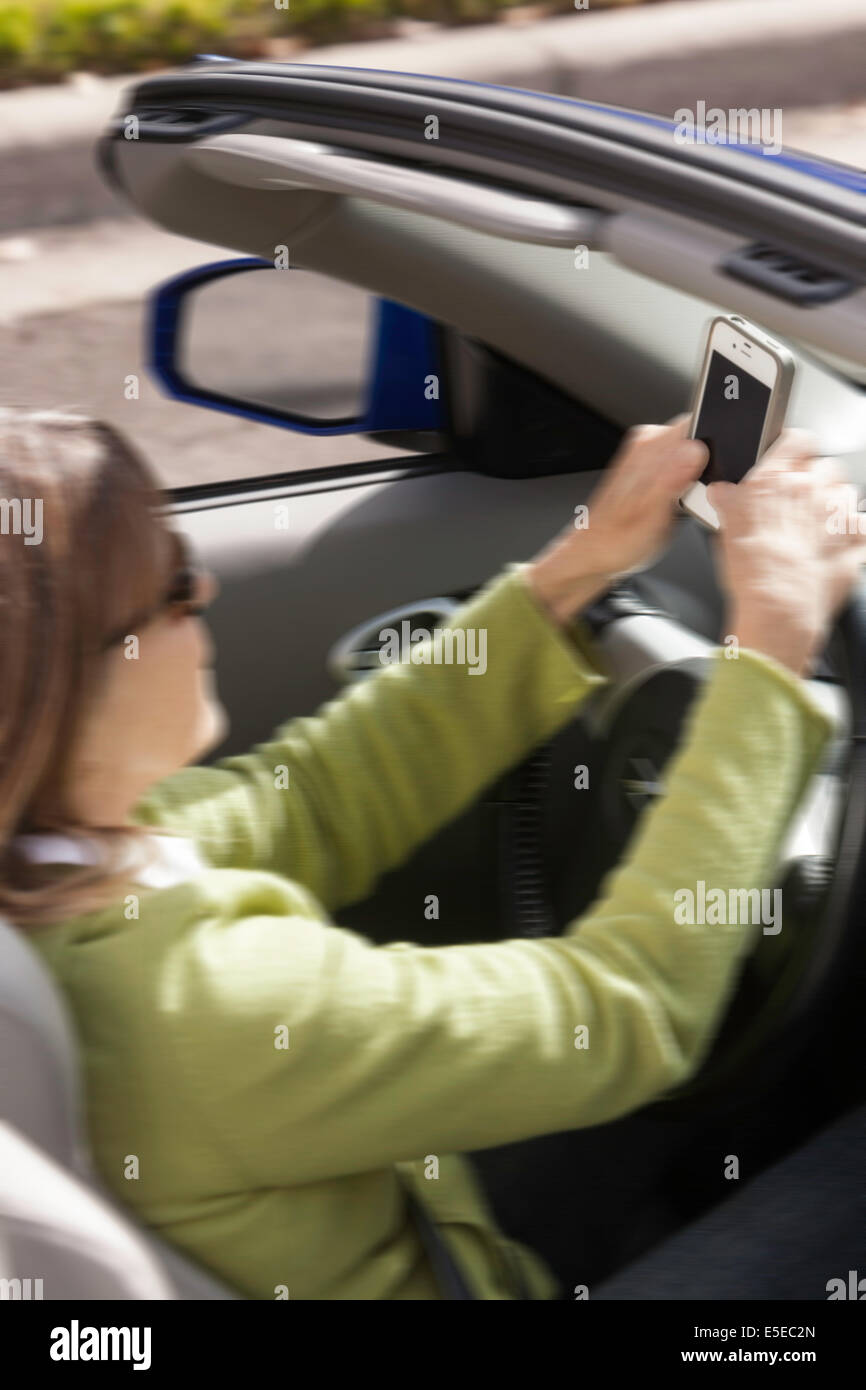 Female driver text messaging on hi-res stock photography and images - Alamy