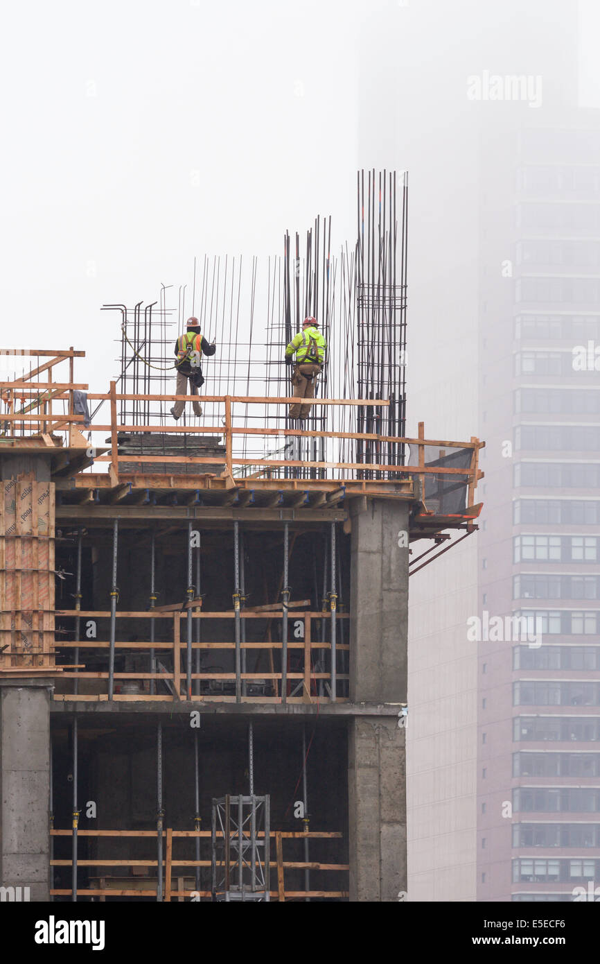 High-rise Building Construction Site with Tradesmen in The Fog, NYC ...