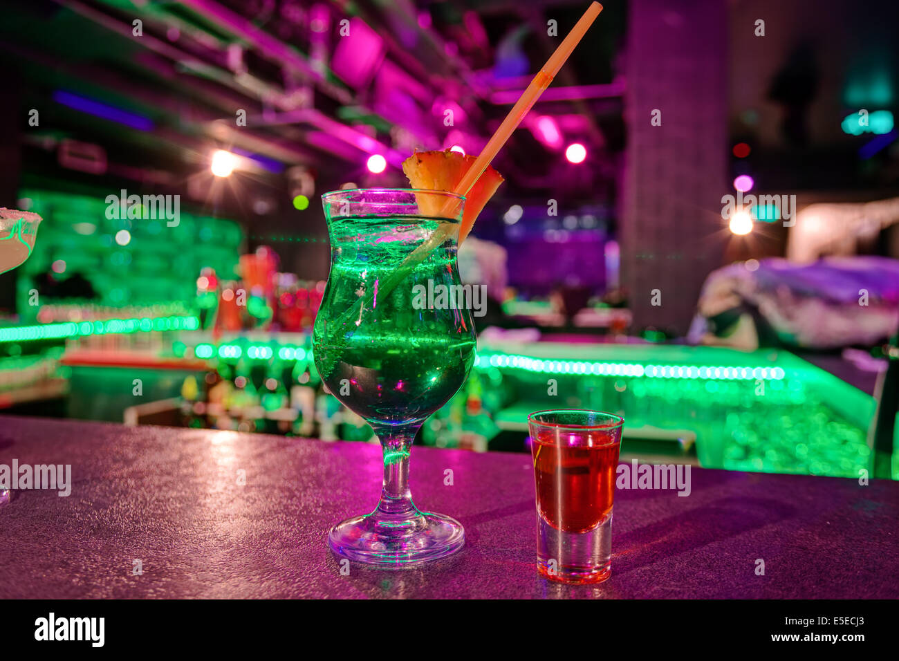 cocktail at bar in a night club with vivid colors Stock Photo - Alamy