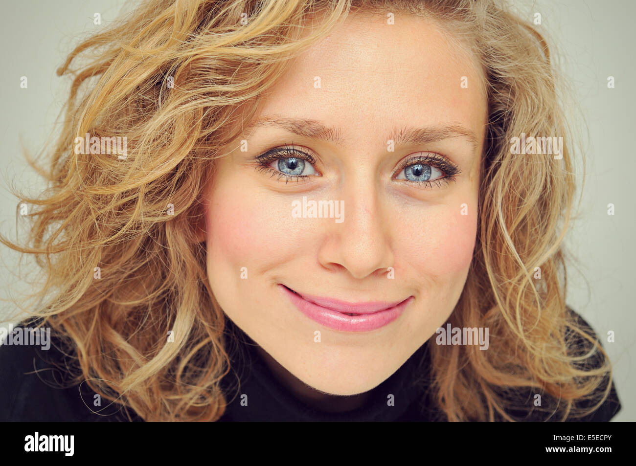 Cute Woman looking up into the camera with her intense eyes Stock Photo ...