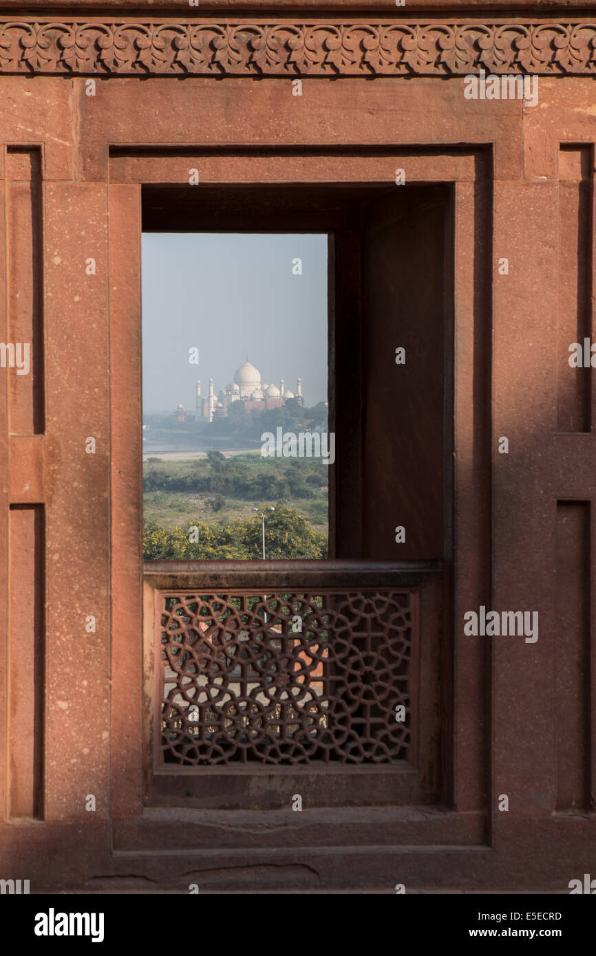 The Taj Mahal seen through a window in Agra Fort, Agra, India Stock ...