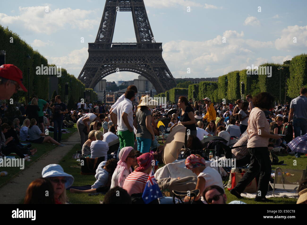 Paris crowd in front of Eiffel Tower on lawns of Champ de Mars on ...