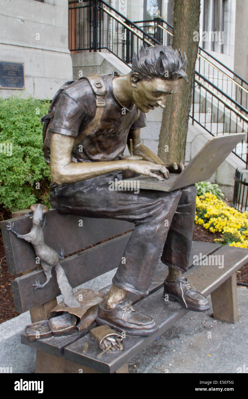 Humerous statue of student working on a computer while a squirrel ...